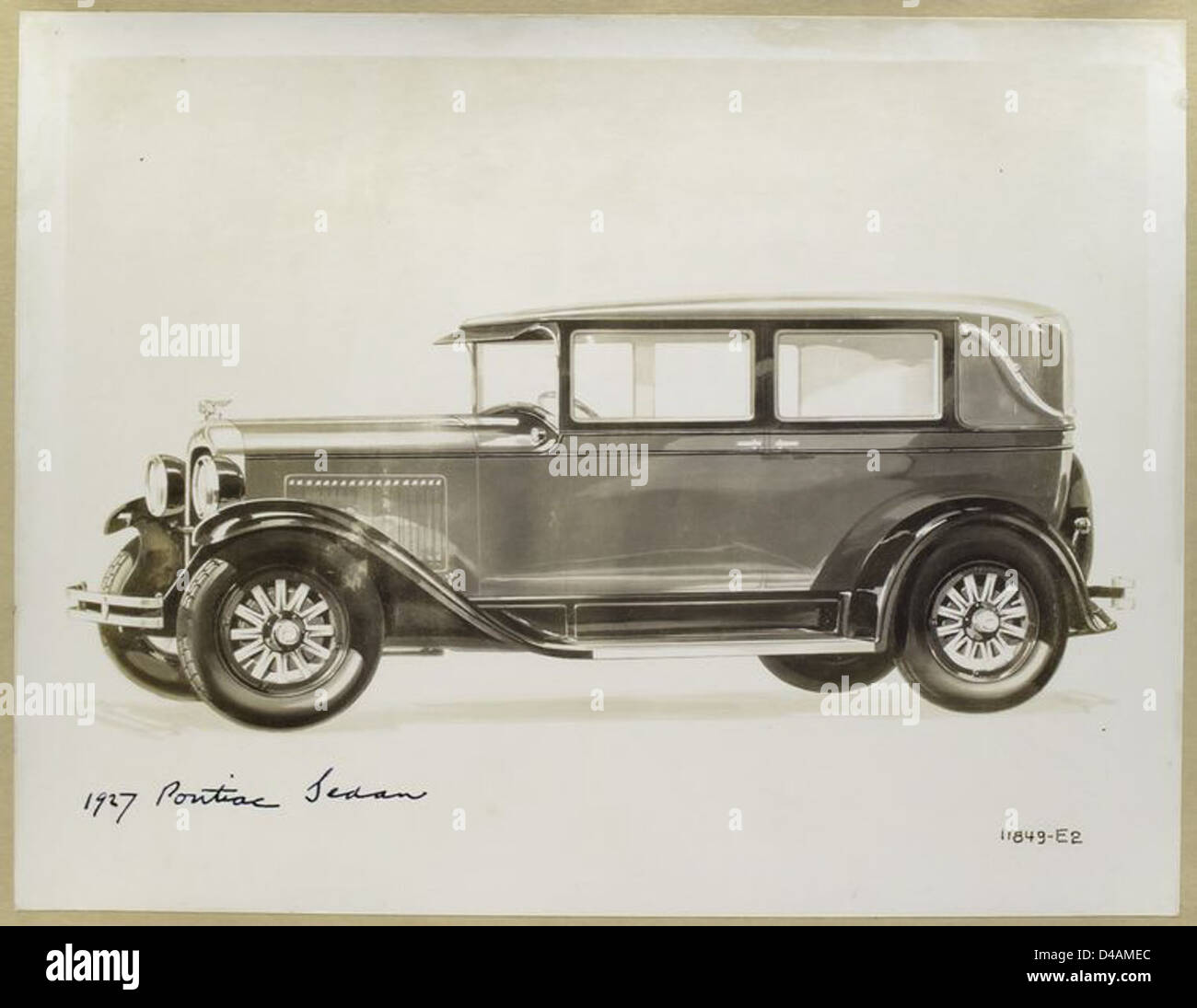 This 1927 photograph shows a Pontiac sedan, produced by General Motors ...