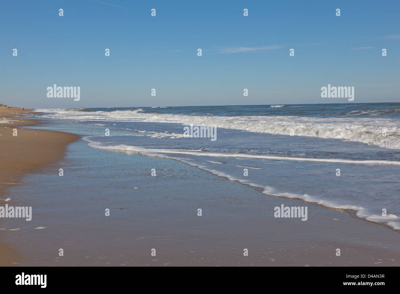 Waves receding from a beach in North Carolina Stock Photo - Alamy