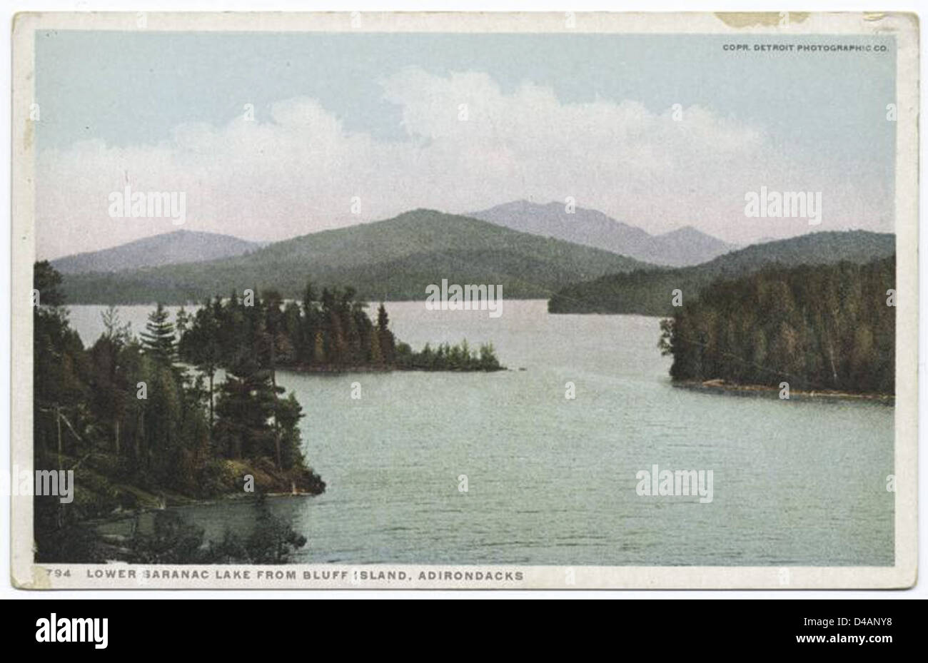 This 1925 postcard shows a view of Lower Saranac Lake from Bluff Island ...