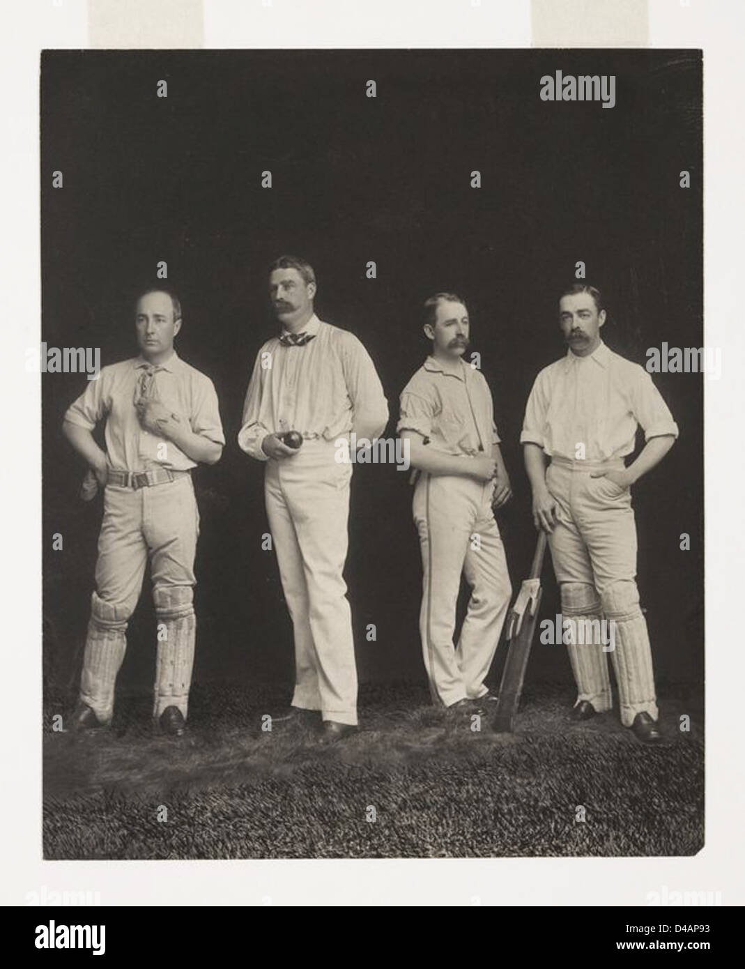 A photograph showing an unidentified group of four cricket players ...
