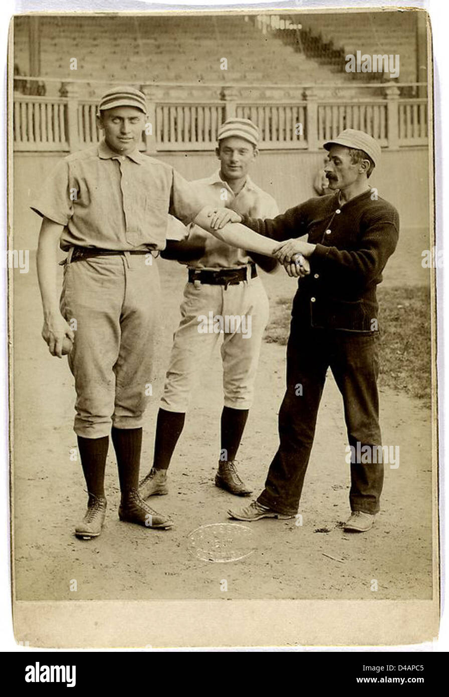 This image depicts Dan Casey, Charlie Bastian, and their trainer ...