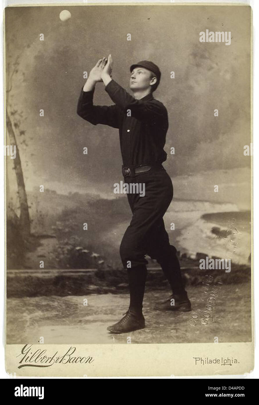 This historical photograph features an unidentified baseball player in ...