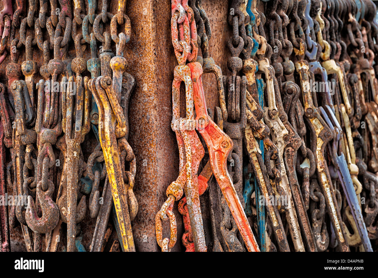 Rusty old load binders hanging from rusted storage bin in Sitka, Alaska ...