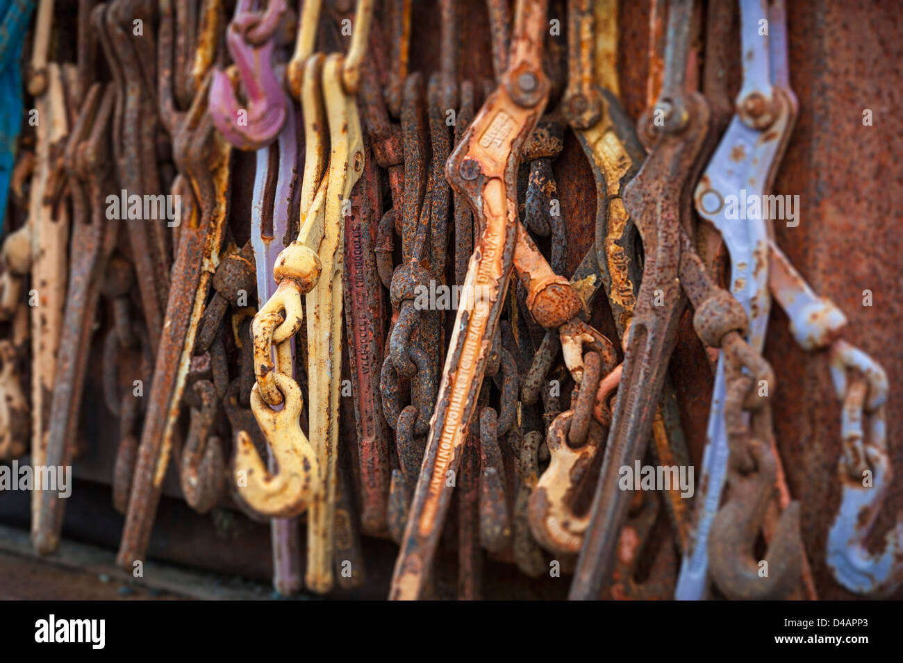 Rusty old load binders hanging from rusted storage bin in Sitka, Alaska ...