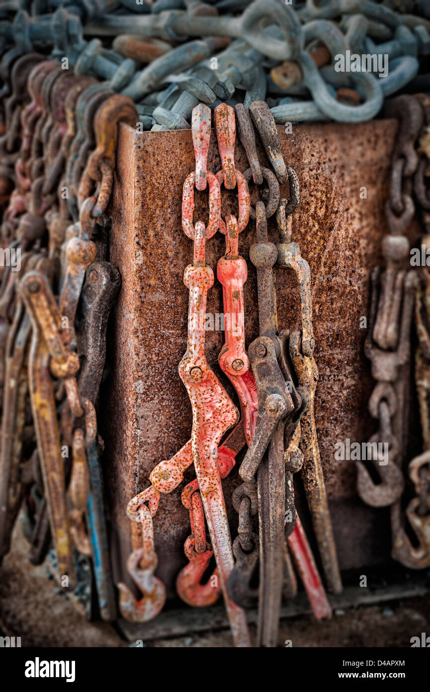 Rusty old load binders hanging from rusted storage bin in Sitka, Alaska ...