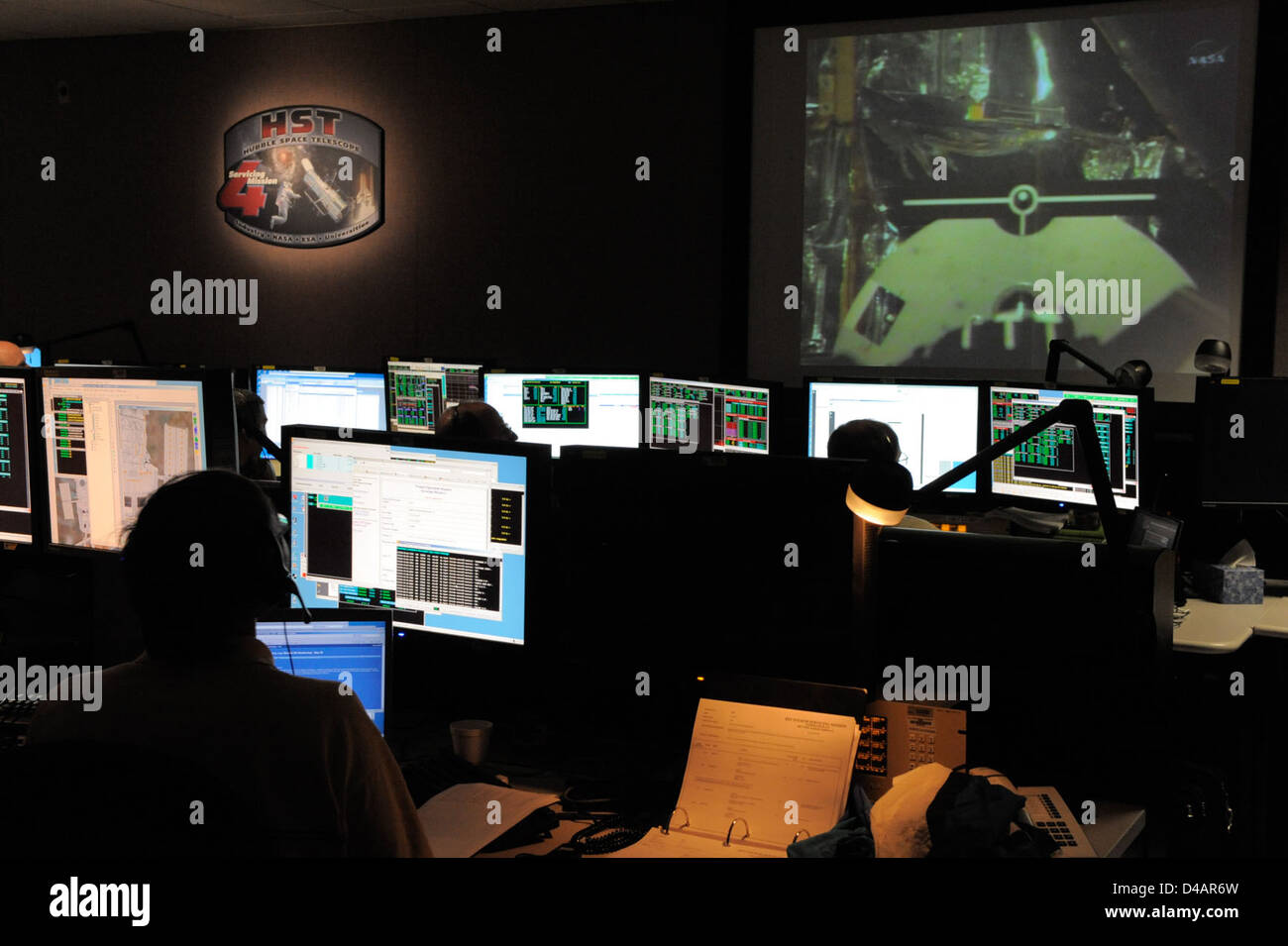 Engineers at Goddard Space Flight Center coordinate the precise ...