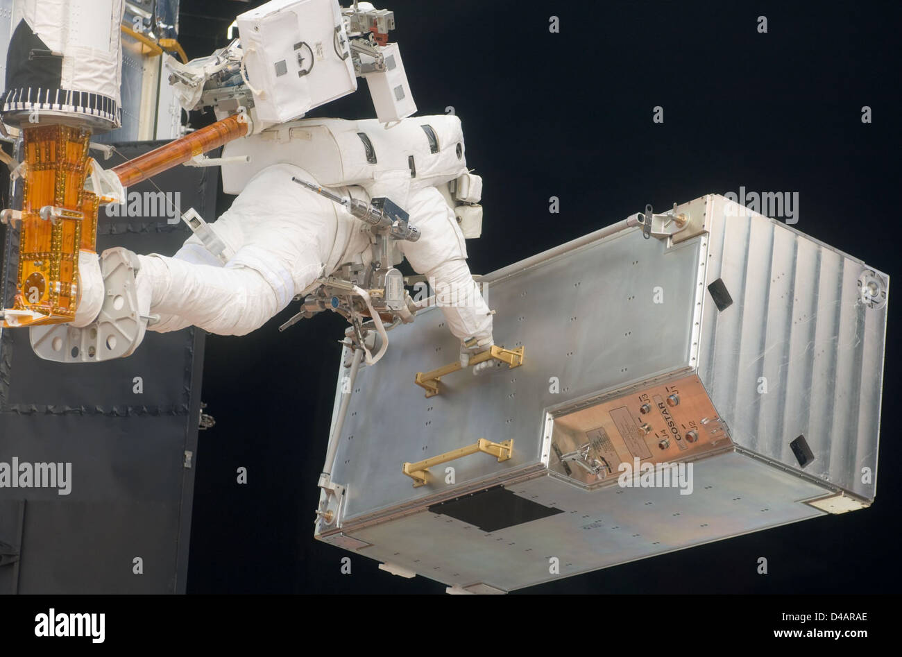 NASA astronauts conduct spacewalks to repair and maintain the Hubble ...