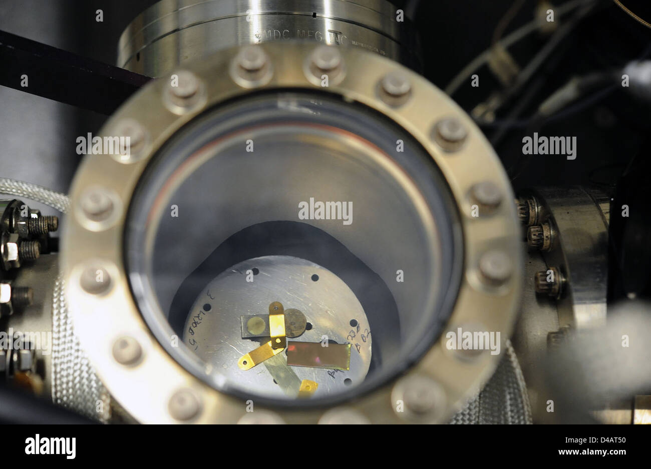 A team analyzes a film believed to be from NASA's Echo II Project. The ...