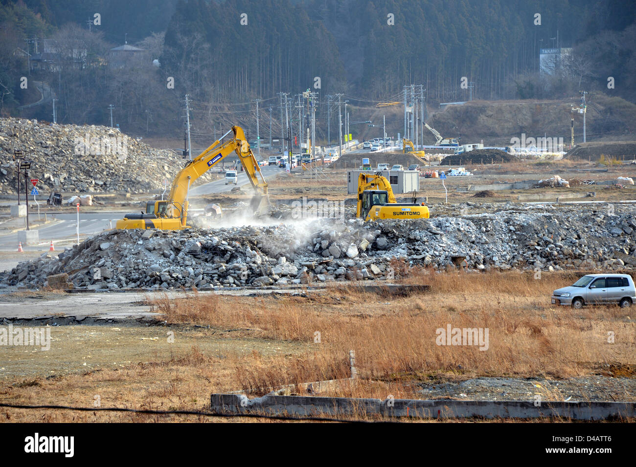 March 8, Minami-Sanriku, Japan - Earth movers level the ground in this ...