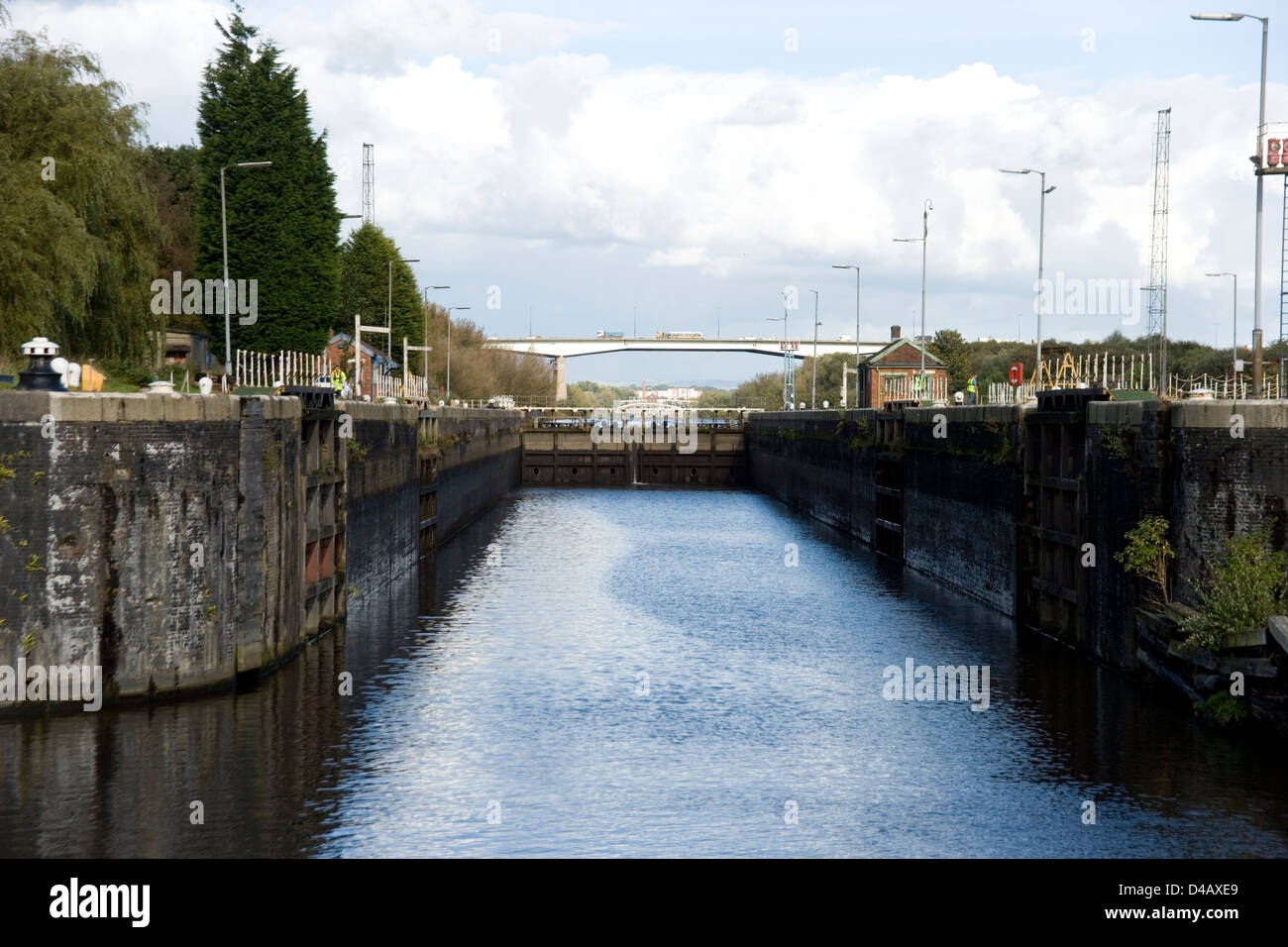 Entering Barton Locks with M60 motorway Barton High Level Bridge behind ...