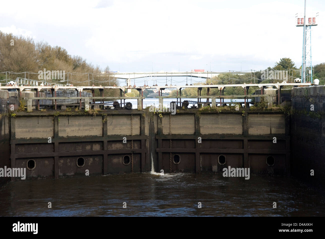 Entering Barton Locks with M60 motorway Barton High Level Bridge behind ...