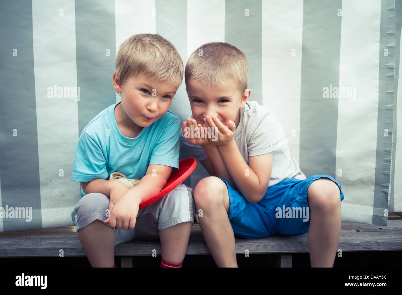 Two brothers talking together sitting hi-res stock photography and ...