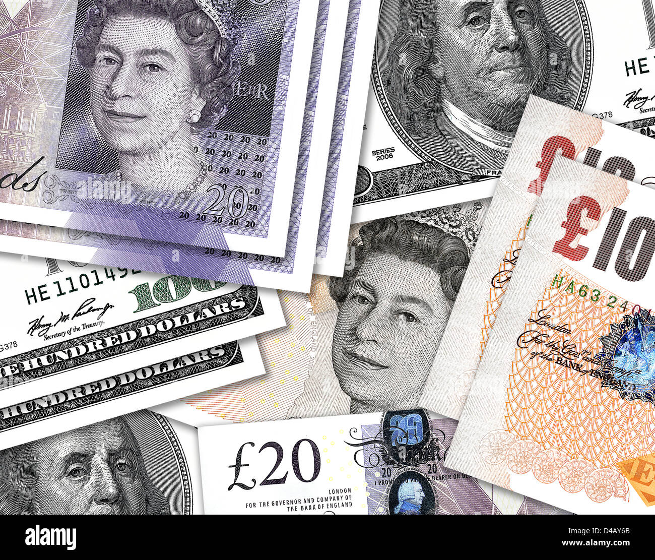Ten and twenty pound notes overlaping hundred Dollar notes. £10, £20 ...