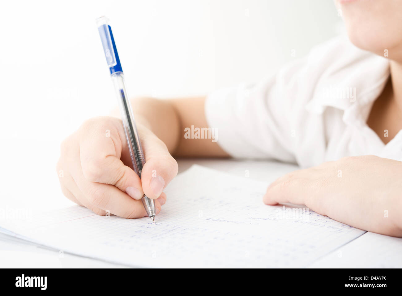 Child writing with pencil hi-res stock photography and images - Alamy