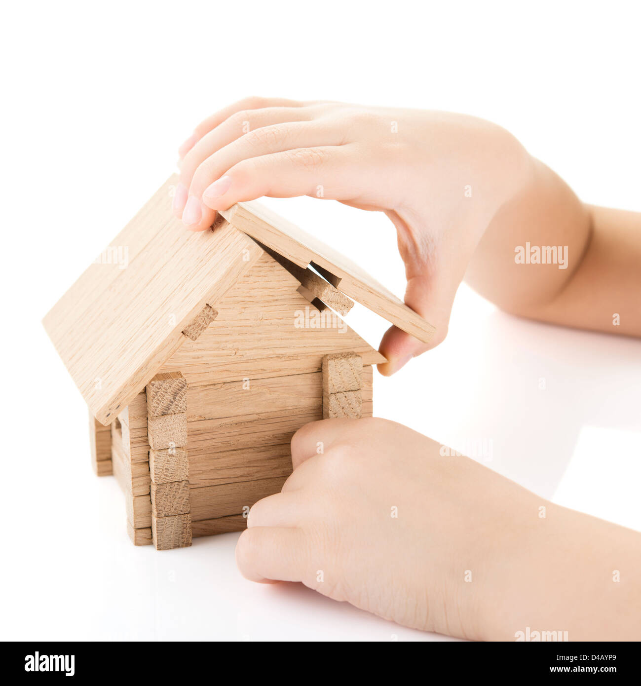 Child hands build a wooden house Stock Photo - Alamy
