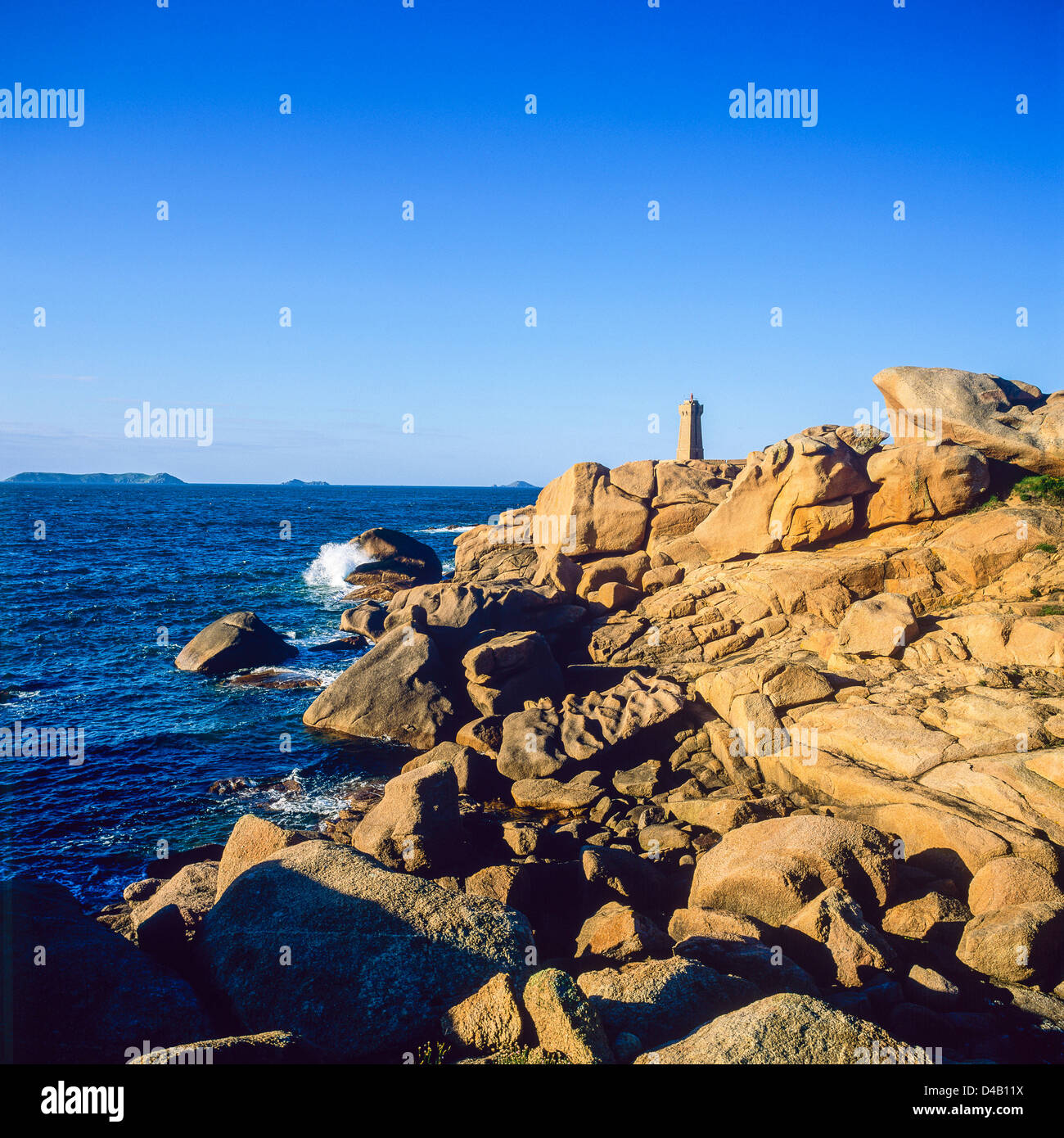Rocks and boulders and Mean Ruz lighthouse, Ploumanach, Côte de granite ...