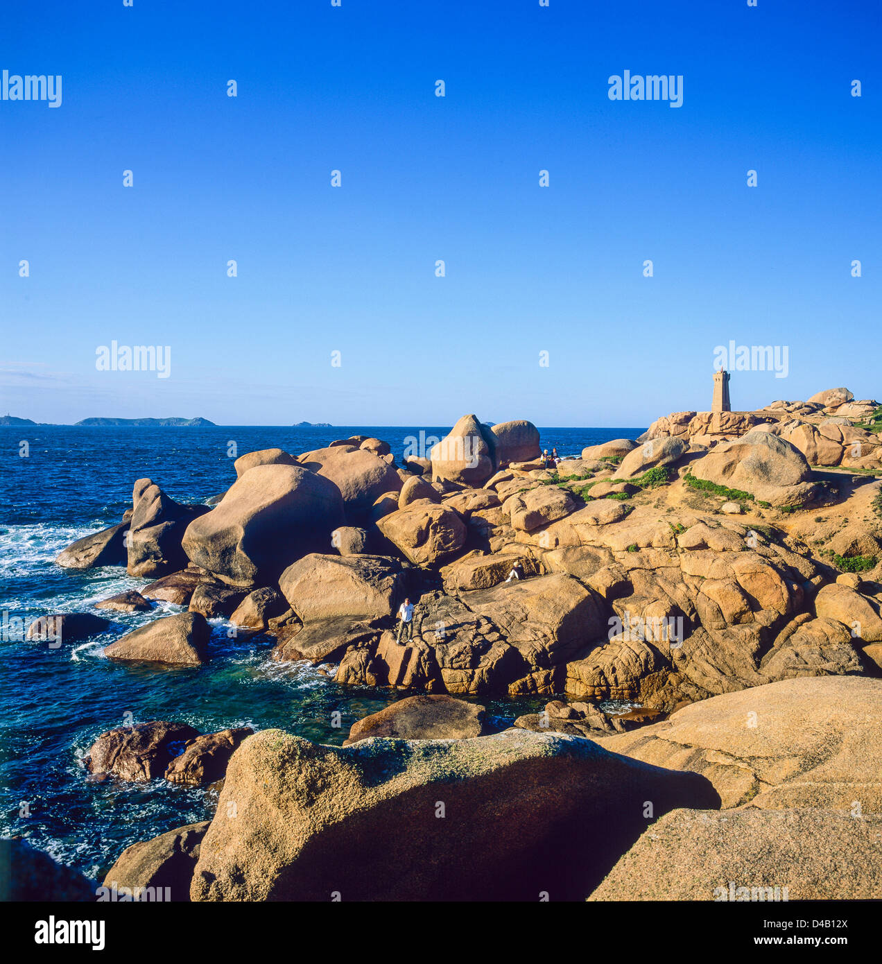 Rocks and boulders and Mean Ruz lighthouse, Ploumanach, Côte de granite ...