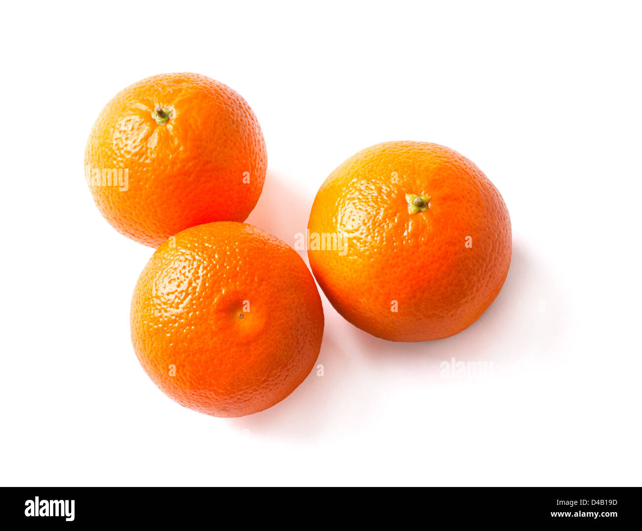 three ripe tangerine on a white background Stock Photo - Alamy