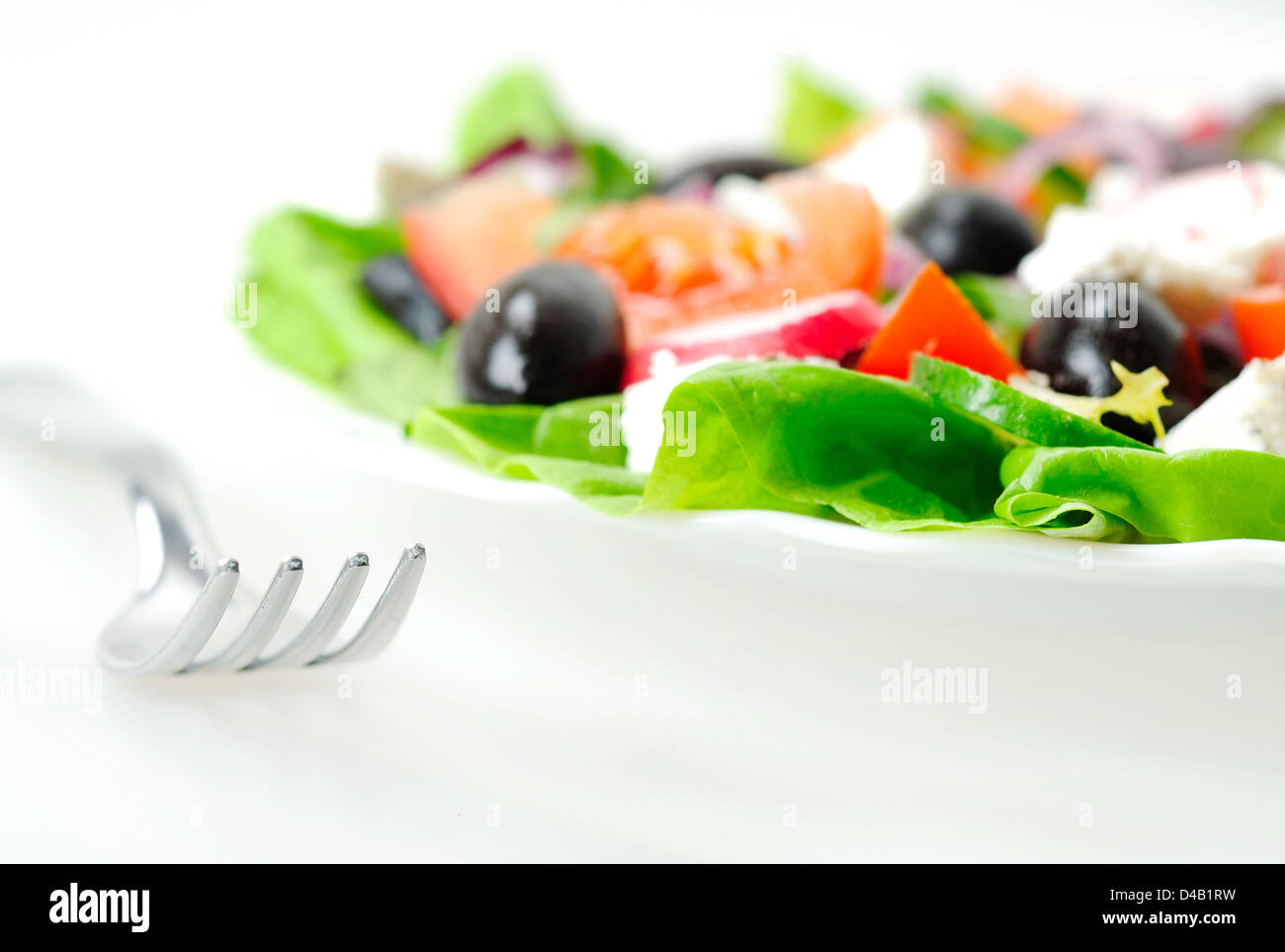 Plate with salad on white Stock Photo - Alamy