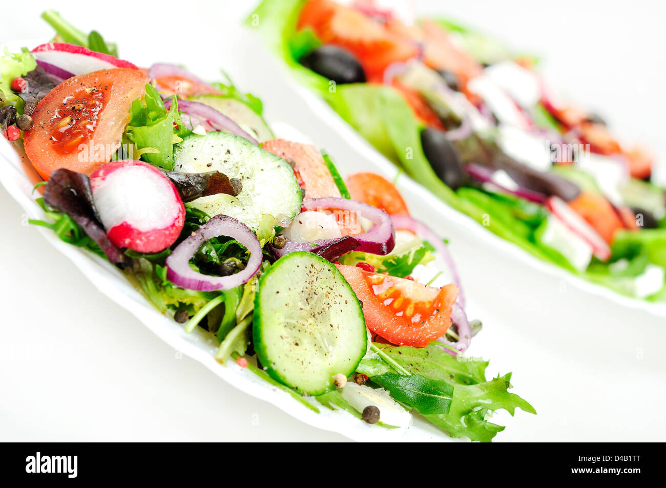 Plate with salad on white Stock Photo - Alamy
