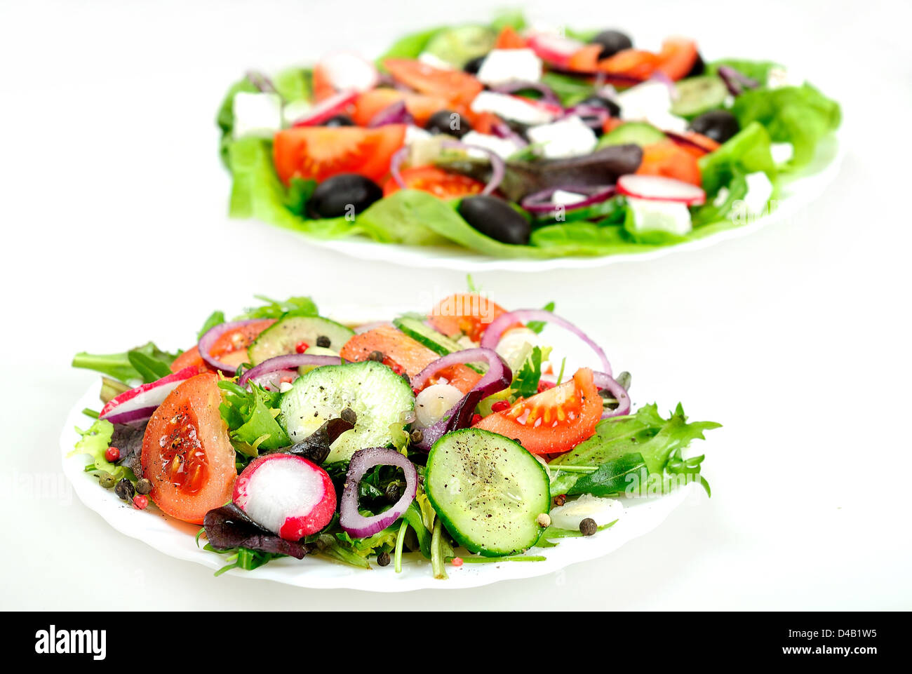 Plate with salad on white Stock Photo - Alamy