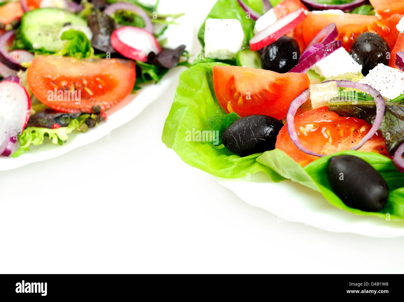 Plate with salad on white Stock Photo - Alamy