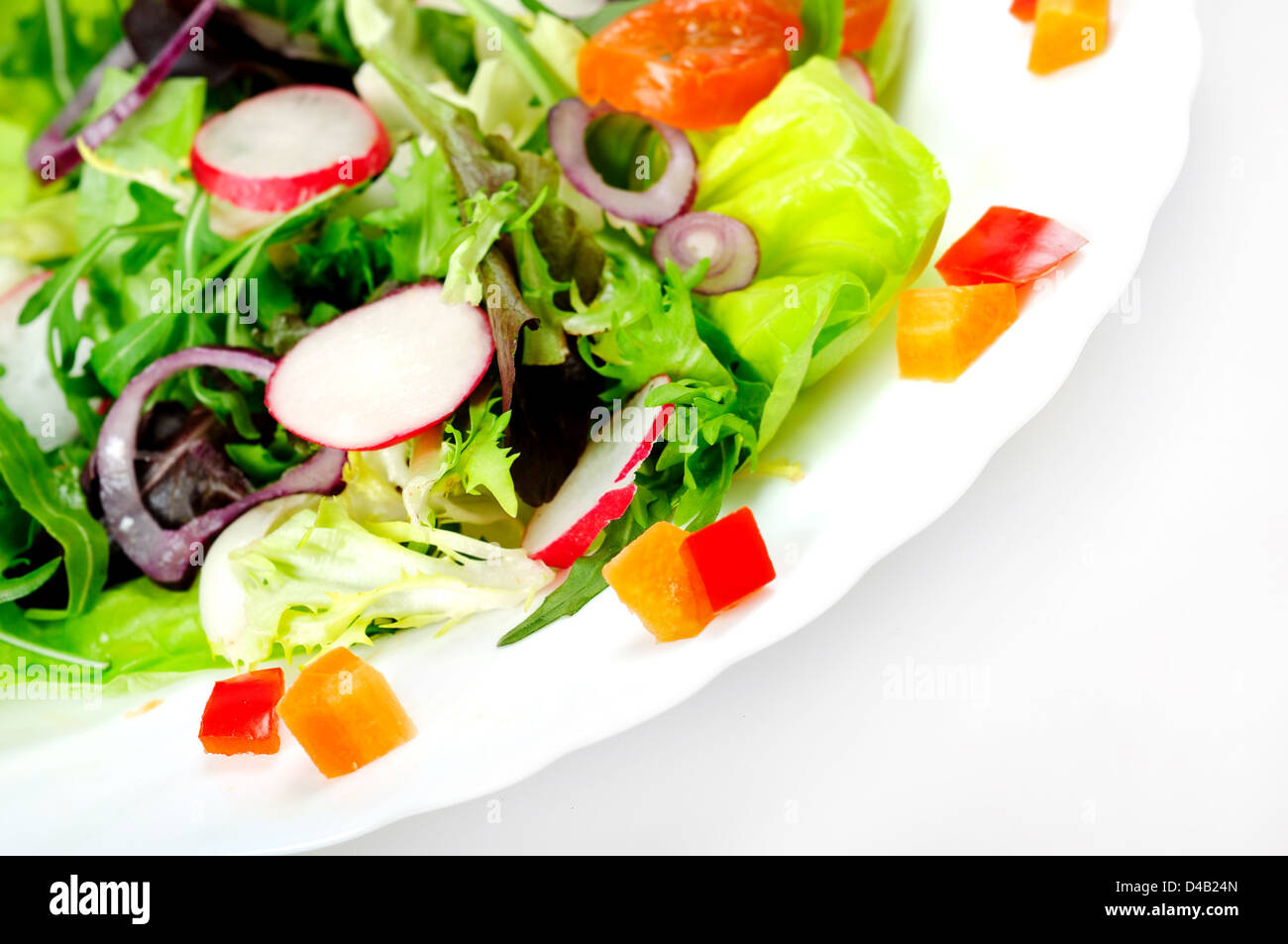 Plate with salad on white Stock Photo - Alamy