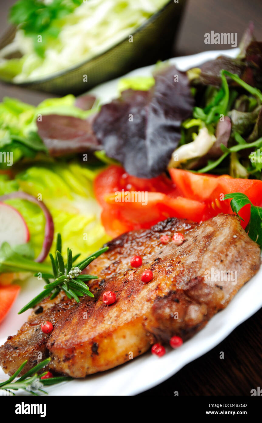Plate with salad and meat Stock Photo - Alamy
