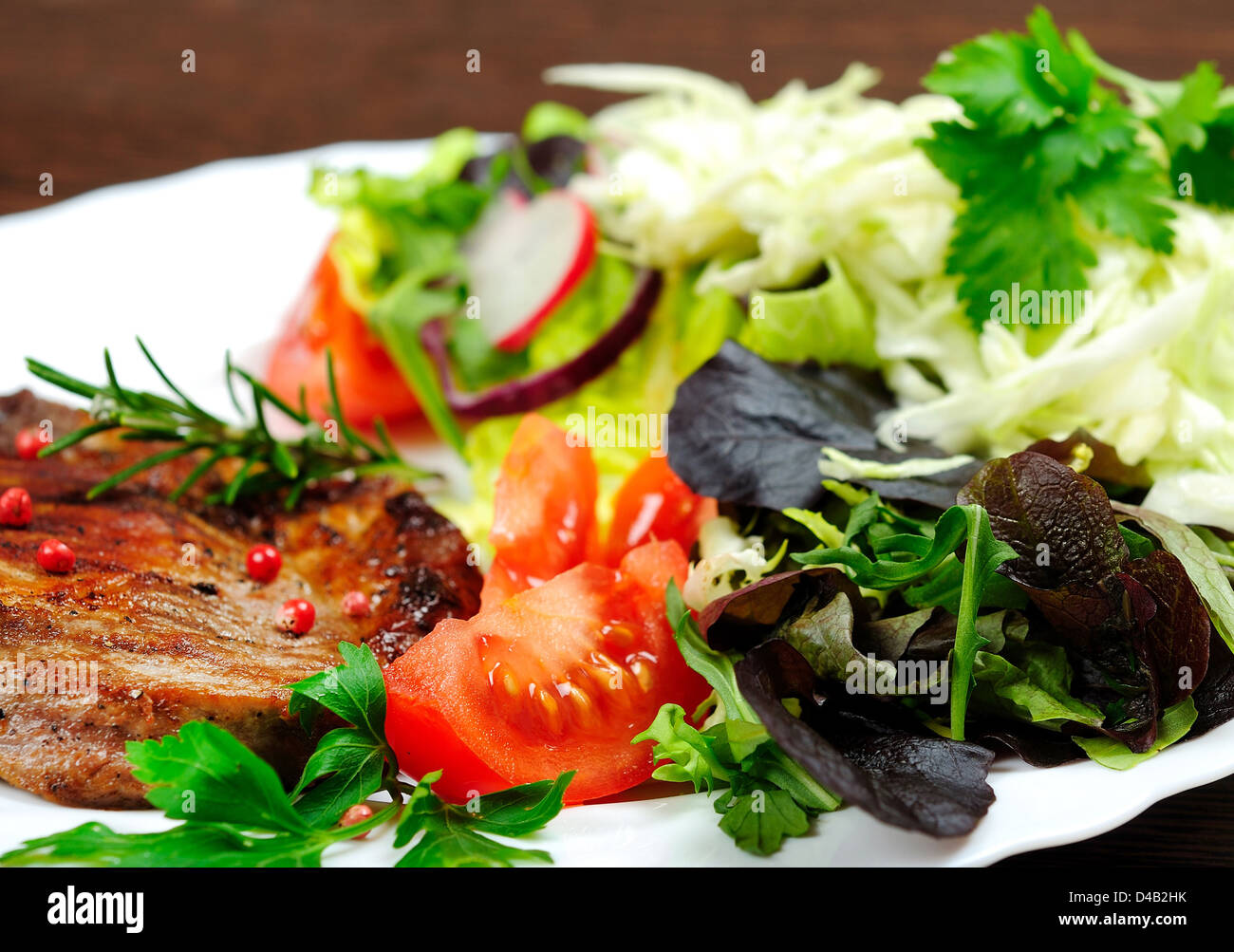 Plate with salad and meat Stock Photo - Alamy