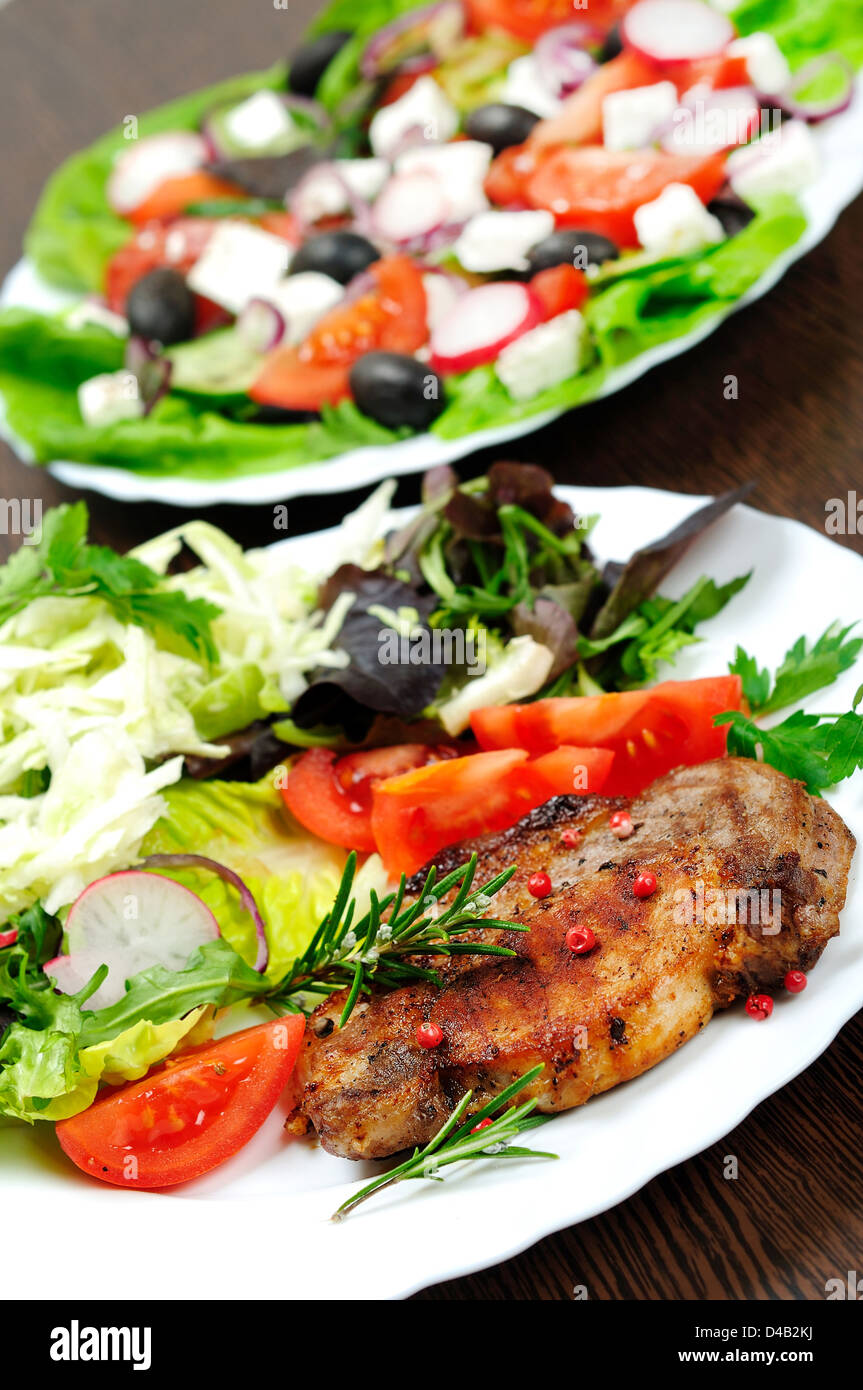 Plate with salad and meat Stock Photo - Alamy