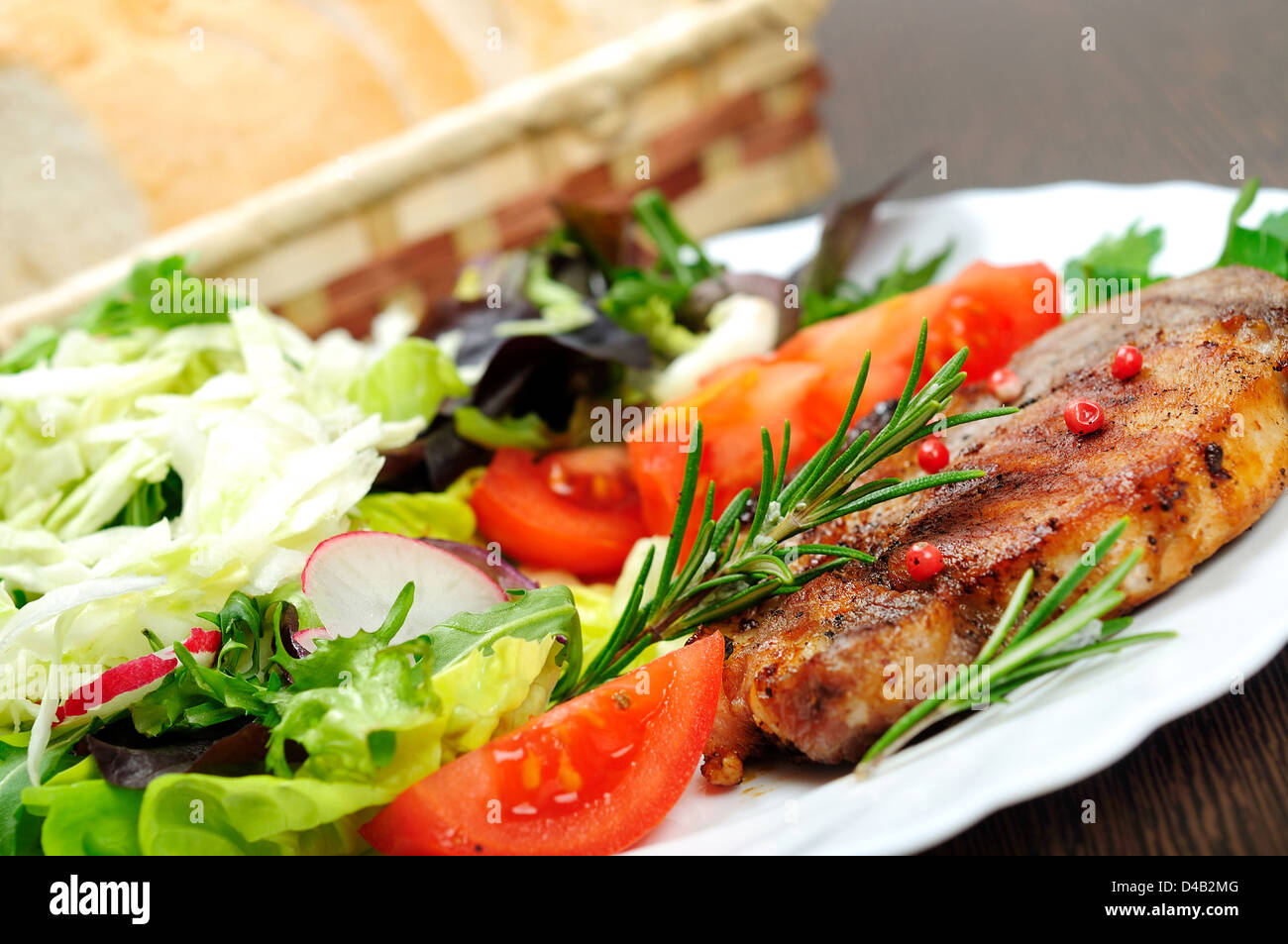 Plate with salad and meat Stock Photo - Alamy