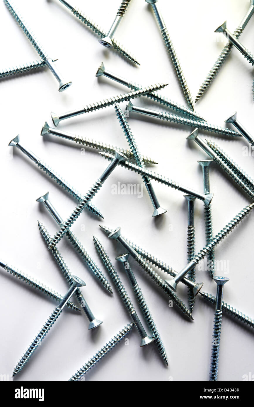 Screw Fixings still life with many screws on white background Stock ...