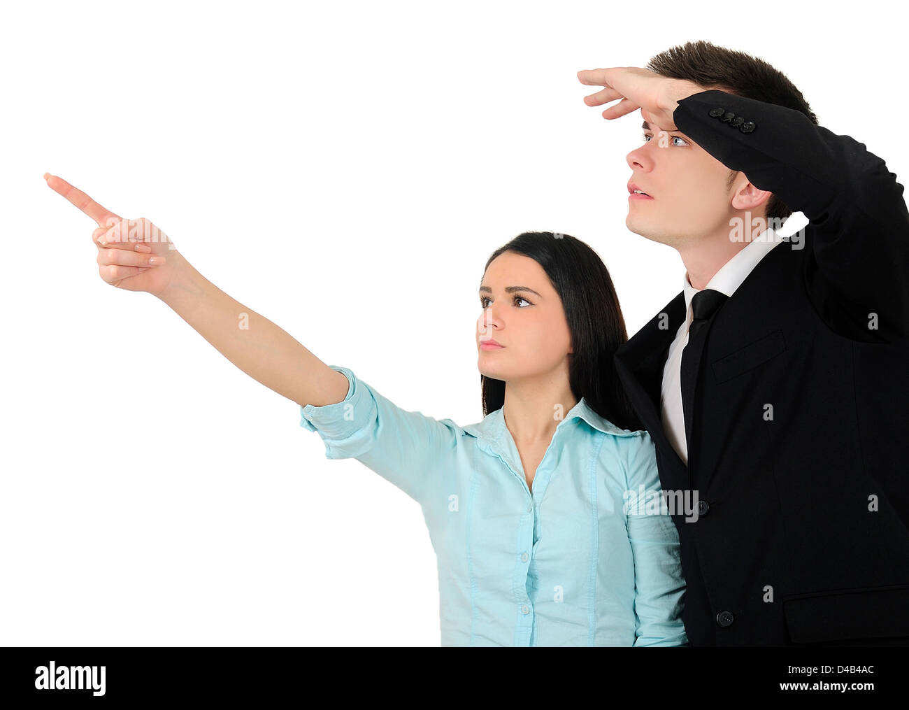 Isolated young business couple pointing Stock Photo - Alamy