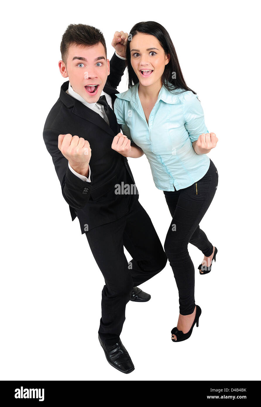 Isolated young business couple victory Stock Photo - Alamy