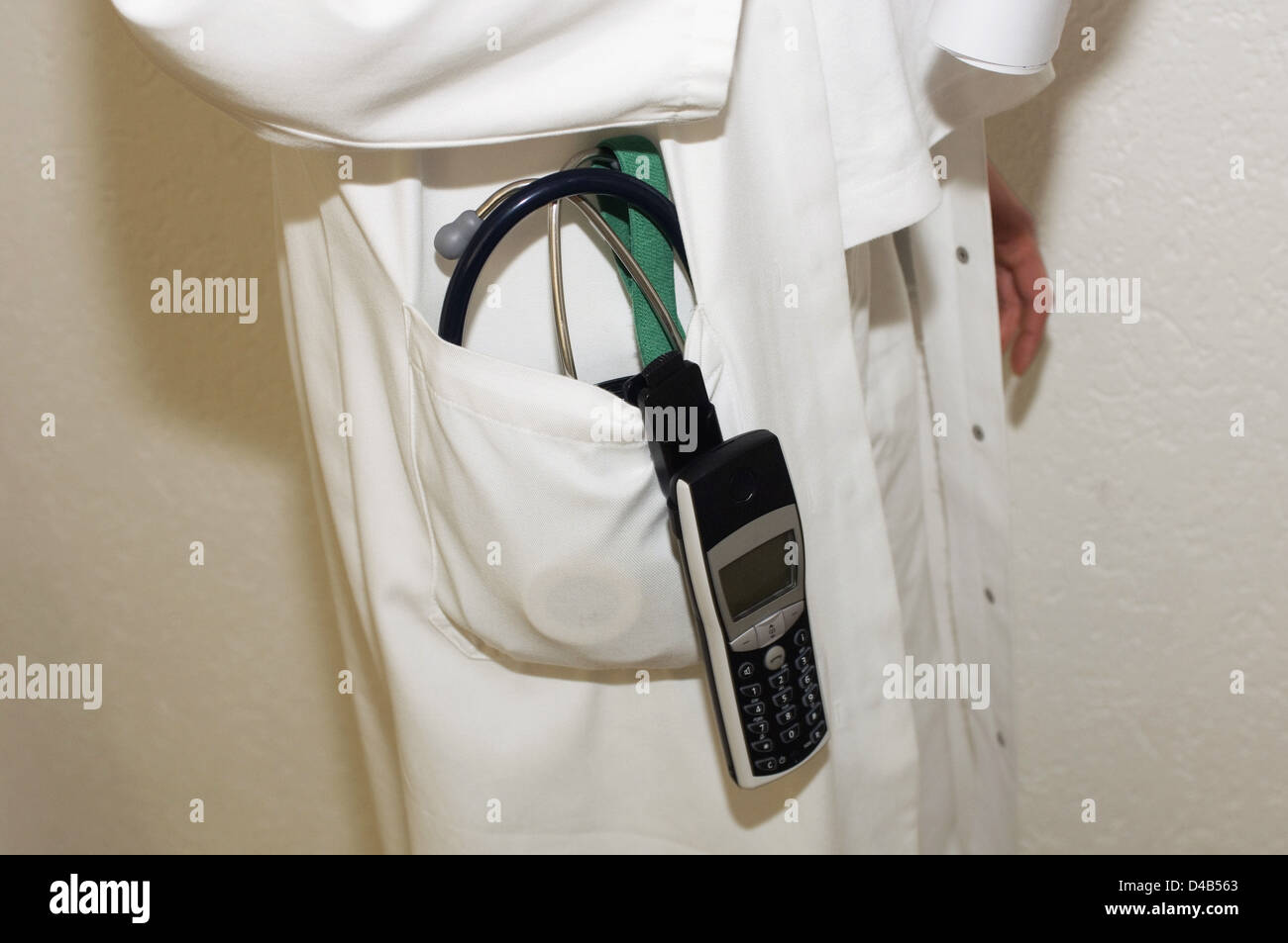 Mobile phone in doctors pocket Stock Photo - Alamy