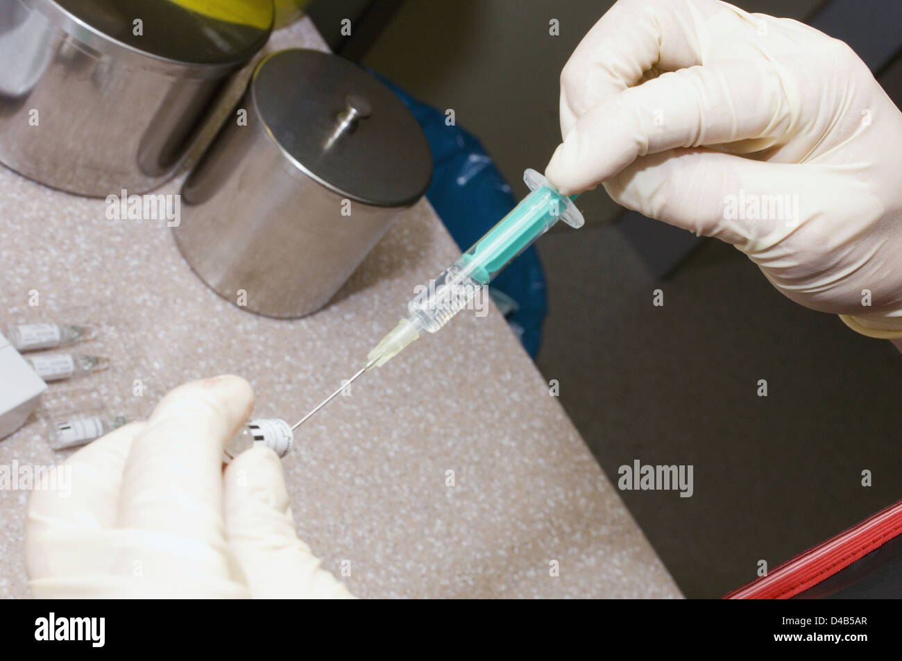 Hand of nurse filling syringe with drug Stock Photo - Alamy