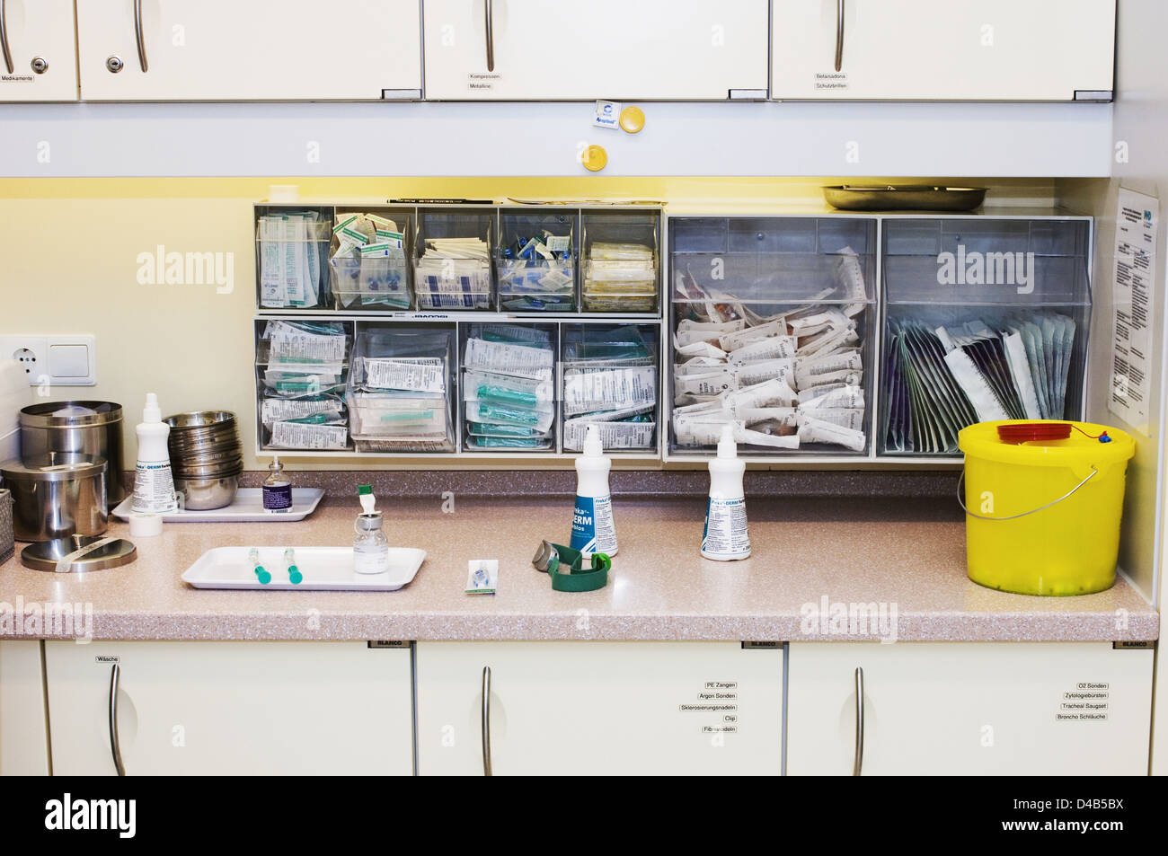 Various medical equipment on table and on shelves Stock Photo - Alamy