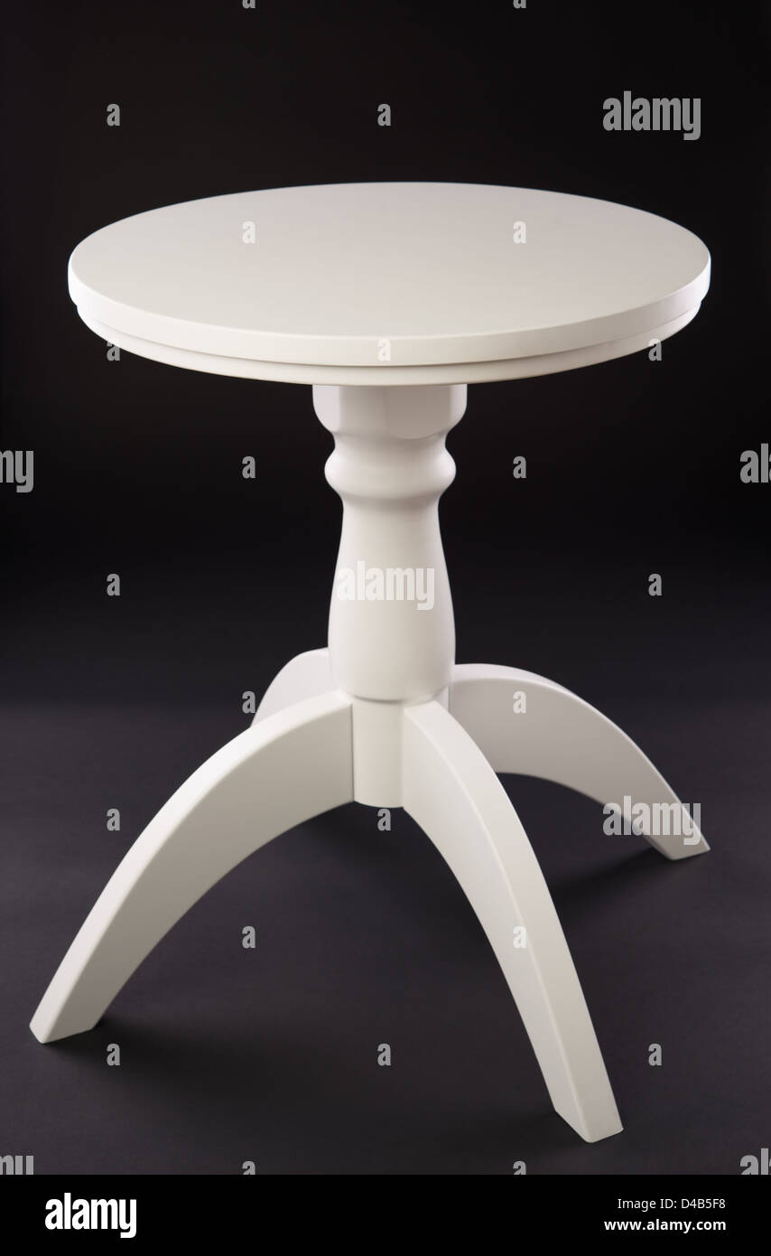 White Wooden table on black background Stock Photo - Alamy