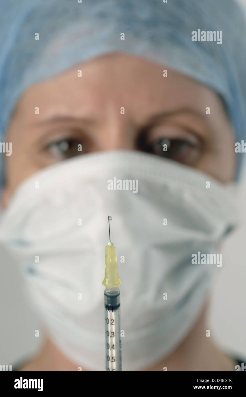 Doctor analysing syringe sample Stock Photo - Alamy