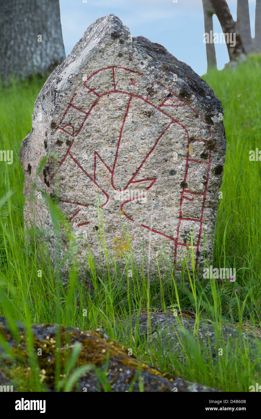 Swedish old rune stone in green grass Stock Photo - Alamy