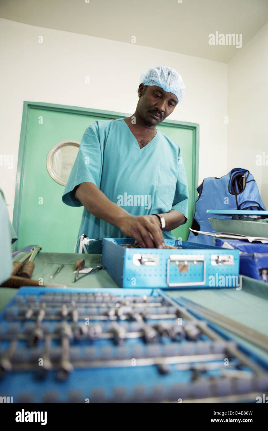 Hospital surgery assistant prepare various surgical tools before ...