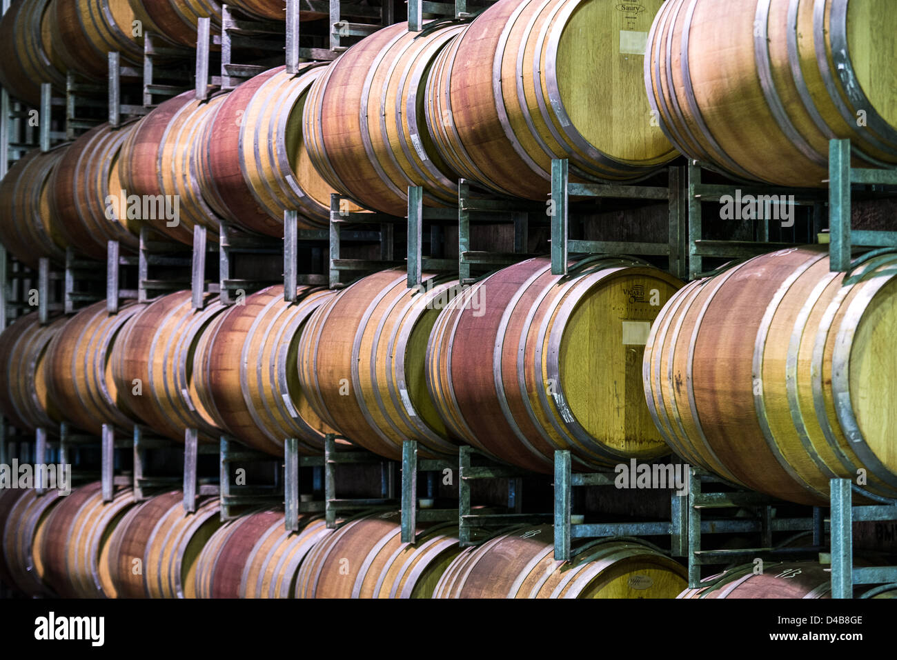 Wine barrels stacked in the cellar of a winery in Australia Stock Photo ...
