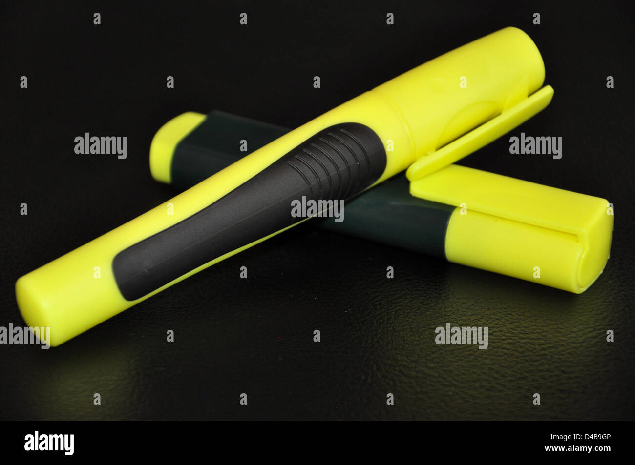 Yellow colored pens Stock Photo - Alamy