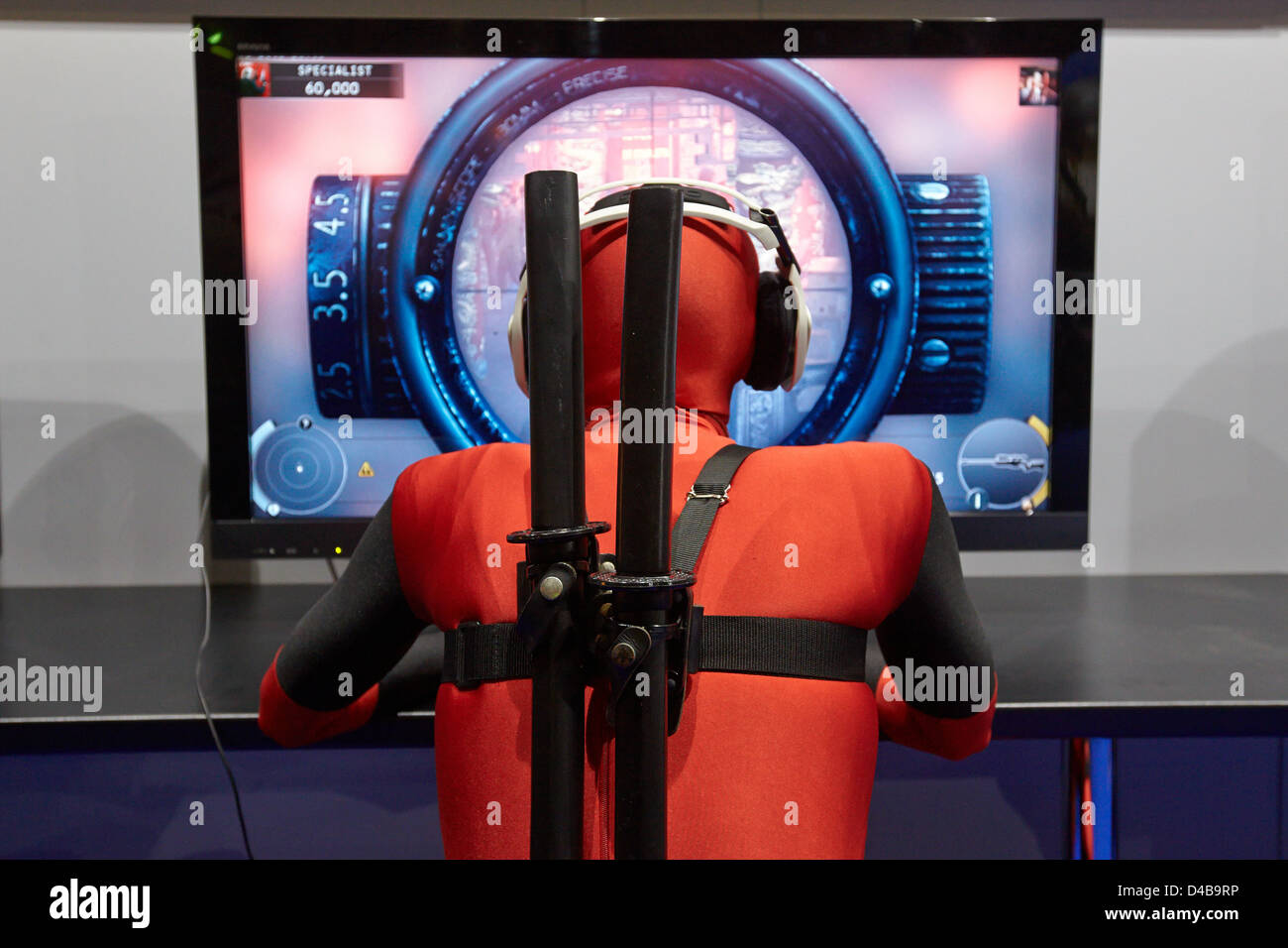 A visitor dressed as character Deadpool tries out an unreleased ...