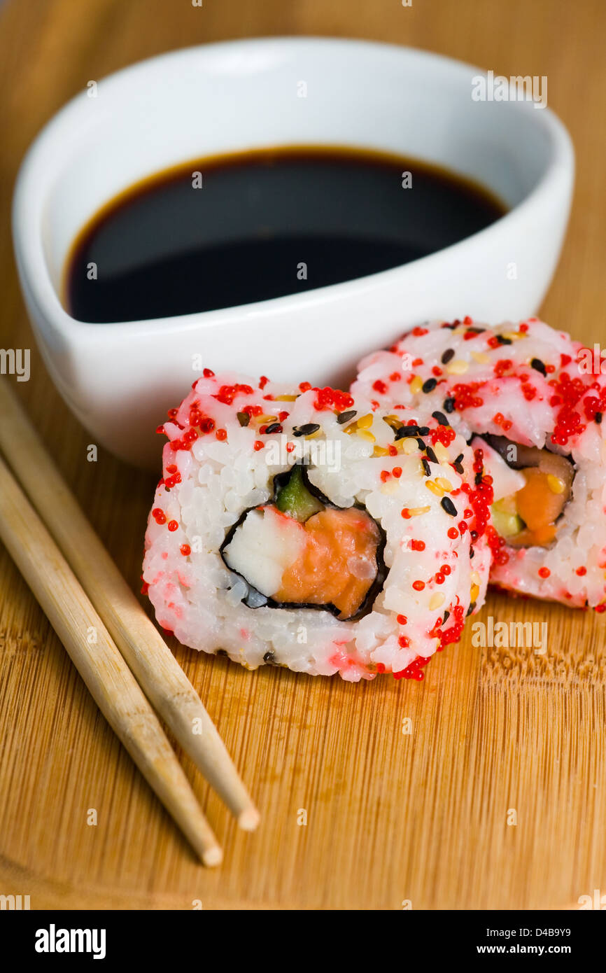 sushi in row on bamboo mat Stock Photo - Alamy