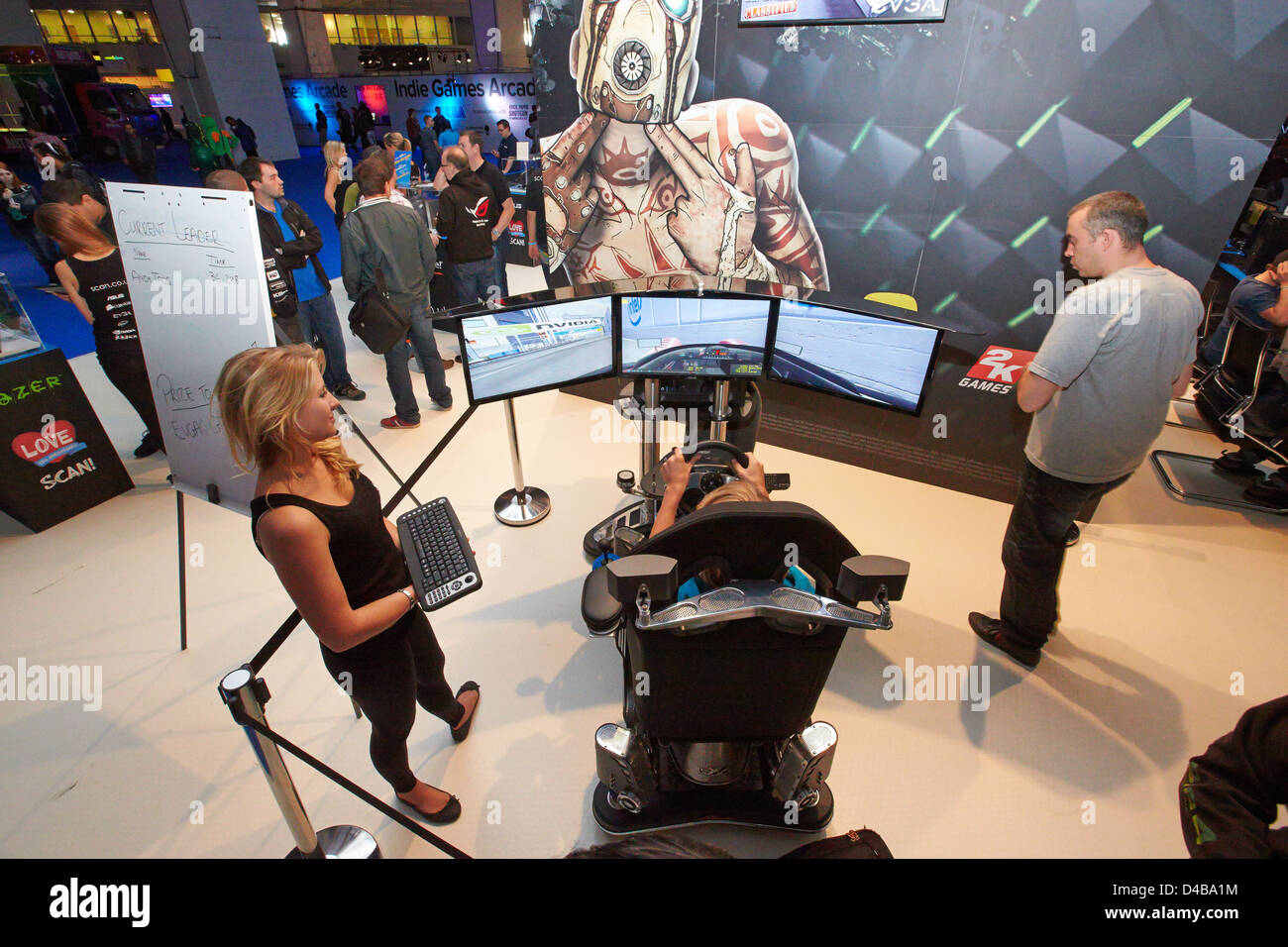 A visitor tries out a motion chair and driving computer game at the ...