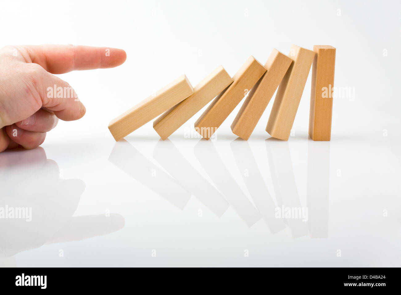 Hand and falling pieces on white background Stock Photo - Alamy