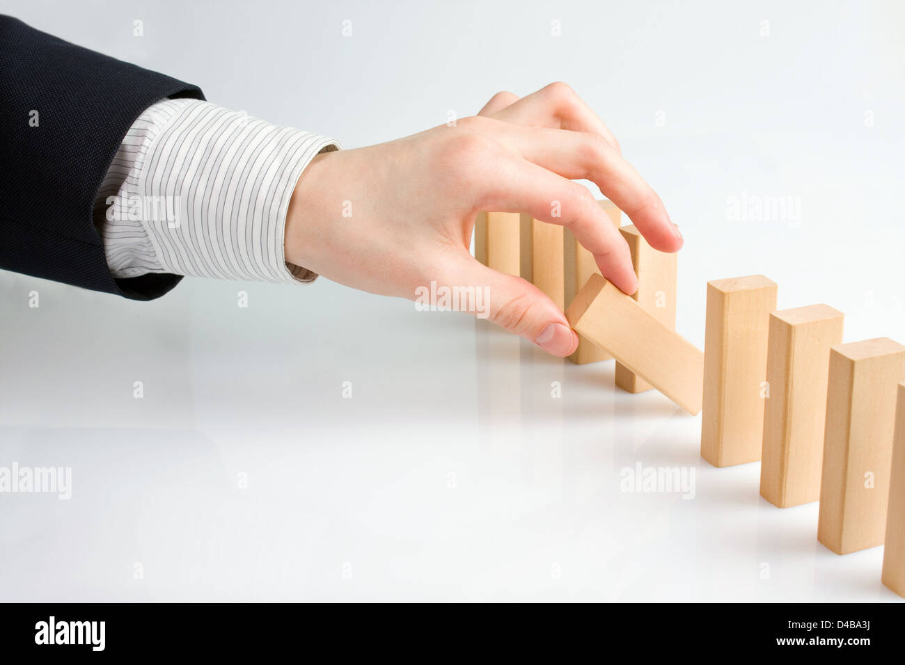 Concept for solution to a problem by stopping the domino effect Stock ...