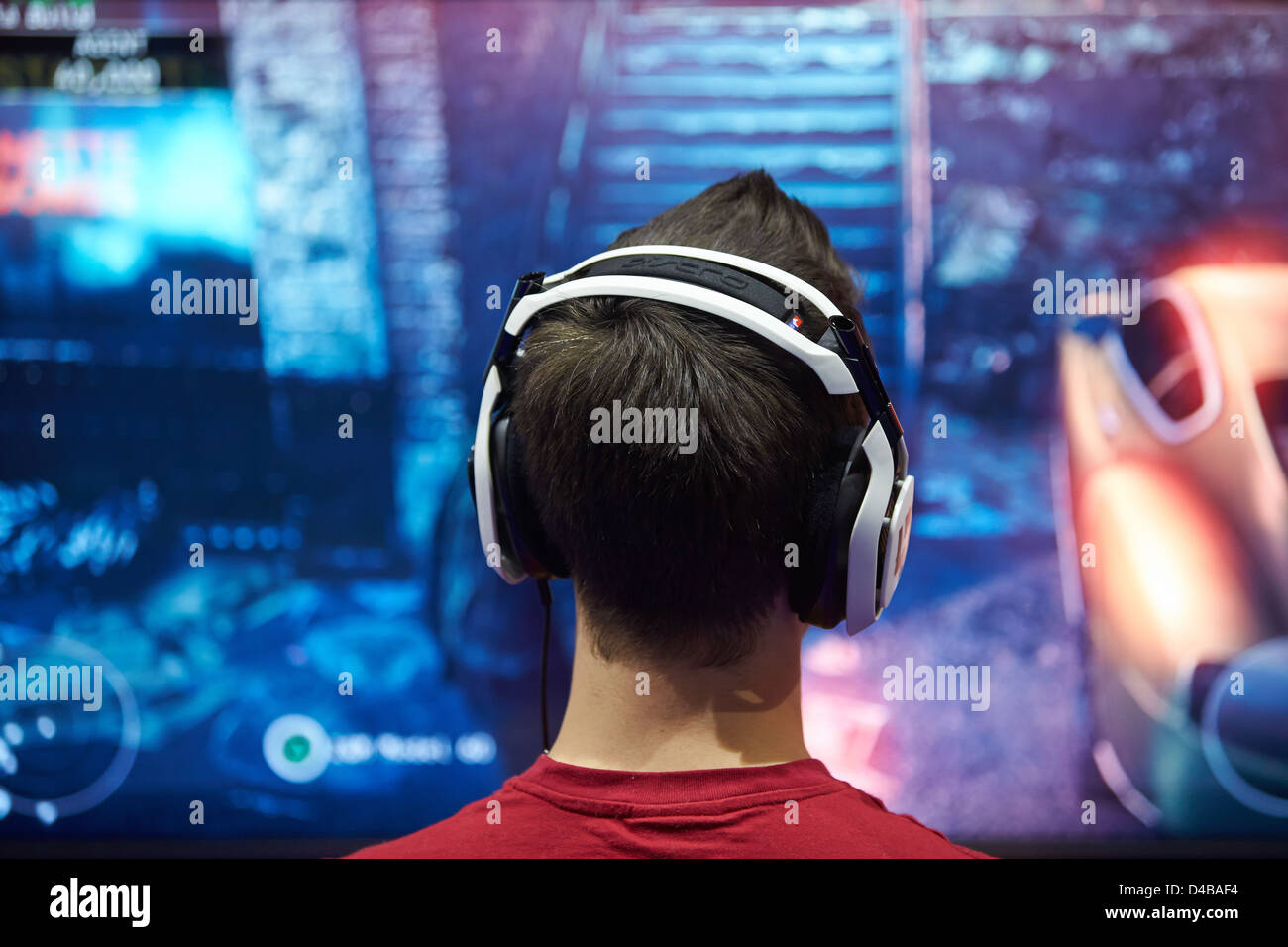 A visitor tries out an unreleased computer game at the Eurogamer Expo ...