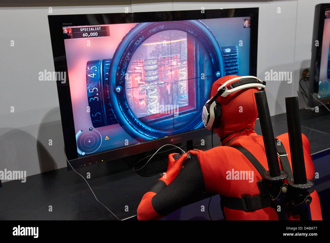 A visitor dressed as character Deadpool tries out an unreleased ...